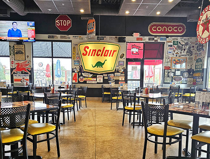 Step inside to a motorhead's paradise where vintage gas station signs and the iconic Sinclair dinosaur create a nostalgic backdrop for memorable meals.