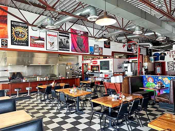 Checkered floors and wooden tables create the perfect backdrop for food-induced happiness. Rock posters add character that can't be manufactured.