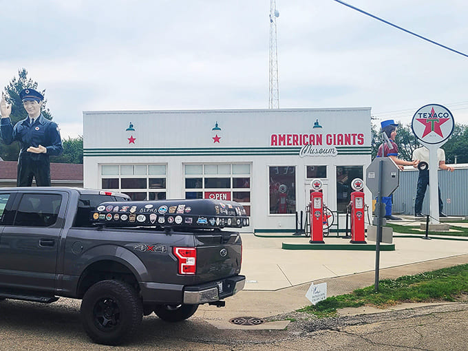 Two cherry-red gas pumps stand sentinel outside the museum, relics from when filling stations were destinations, not just pit stops.