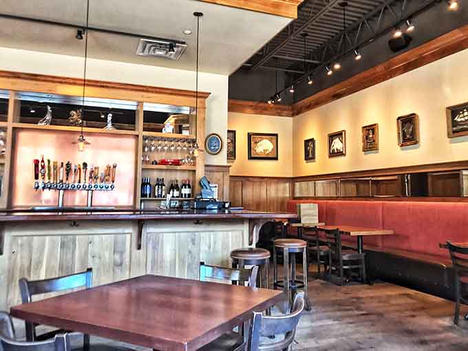 Inside, warm wood tones and thoughtful lighting create the kind of atmosphere where both pints and conversations flow freely.