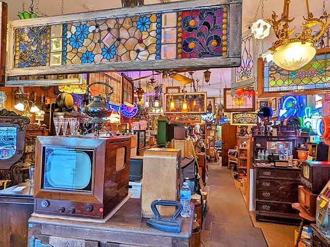 Sunlight streams through stained glass, casting kaleidoscope shadows across treasures from bygone eras.