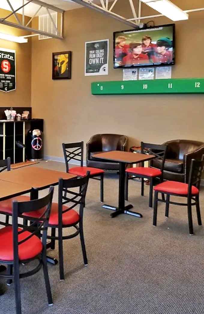 Inside, comfortable seating and Michigan State pride create a welcoming space where donuts are taken seriously but life isn't.