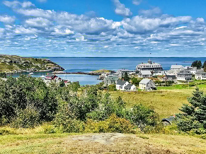 The village nestles between sea and sky, white clapboard houses standing sentinel against the vast Atlantic blue.