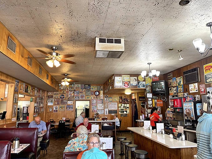 Wood-paneled walls and cozy booths create the perfect backdrop for morning conversations and coffee refills that never seem to end.