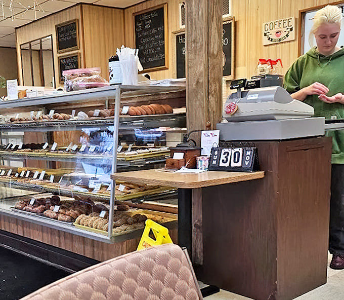 Behind the counter, display cases showcase the day's fresh-made treasures, where decisions become deliciously difficult and willpower goes to die.