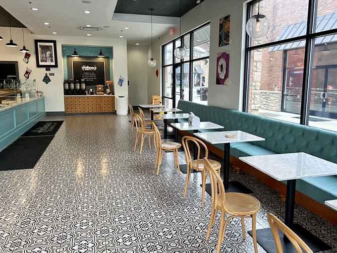 Clean, bright, and inviting, this is where donut dreams come true on patterned floors and teal banquettes.