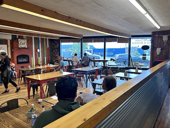 Colorful wooden planks and mismatched chairs create a dining room that feels like your coolest friend's cabin &ndash; if that friend happened to be a taco genius.