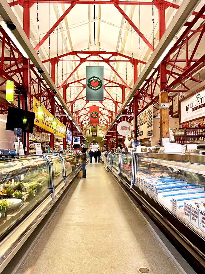 Sunlight streams through the market's soaring ceiling, illuminating the bustling main corridor where generations of Cincinnatians have gathered to shop and socialize.
