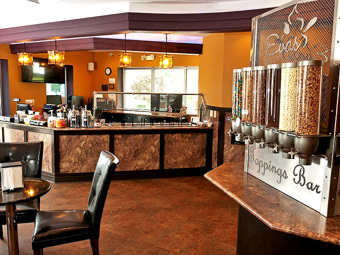 Step inside and feel the warm orange walls contrast with cool treats – this isn't decoration, it's dessert psychology at work.