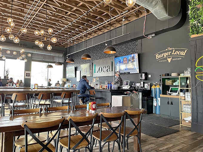 Rustic wooden beams meet corrugated metal ceiling in this cozy space where comfort food dreams come true.