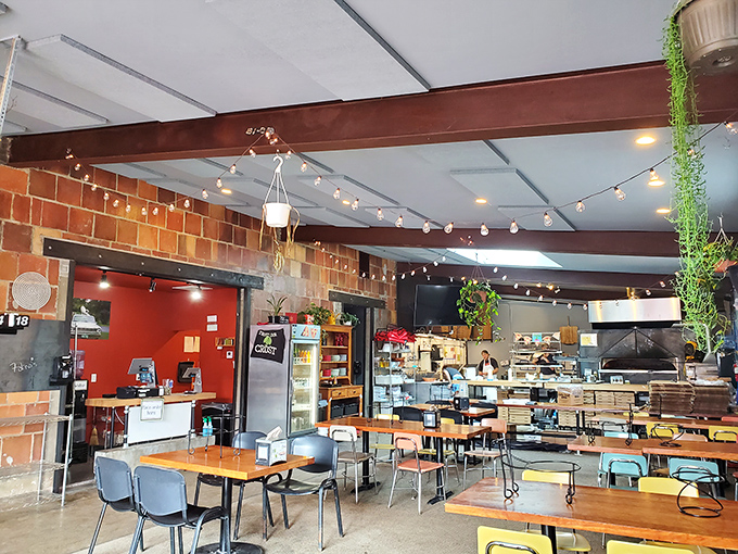 String lights, exposed brick, and hanging plants create that rare vibe where both first dates and family dinners feel equally at home.