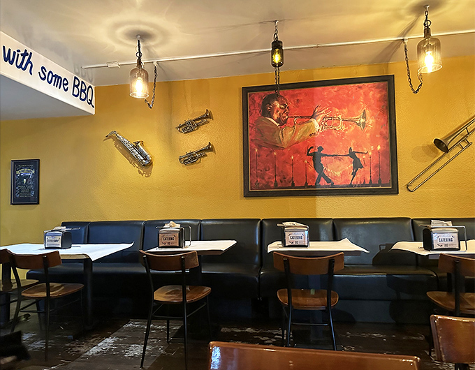 Yellow walls adorned with jazz memorabilia create the perfect backdrop for culinary magic, while Louis Armstrong watches approvingly.