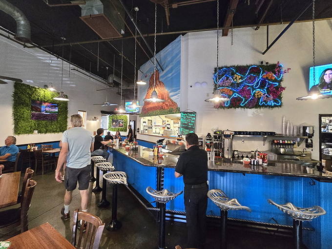 Inside, the bright blue counter and industrial-chic design create a space where desert meets urban cool.