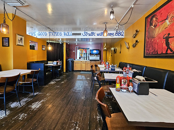 Warm yellow walls and wooden floors create the perfect backdrop for flavor adventures, while the overhead sign promises good times ahead.