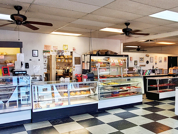 Black and white tiles play chess beneath your feet while display cases stage the ultimate showdown between willpower and temptation.