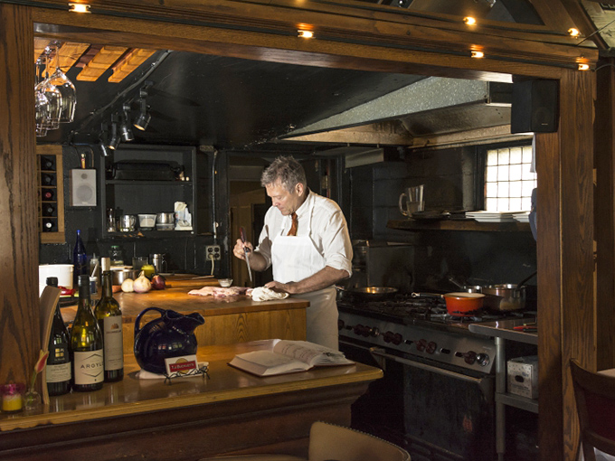 Where magic happens! The open kitchen at T.J. Buckley's lets you witness culinary craftsmanship up close, turning fresh ingredients into edible art.