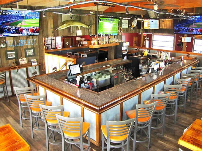 The horseshoe bar isn't just serving drinks, it's telling stories &ndash; each wooden beam and corrugated metal panel whispering tales of Lake Erie adventures.