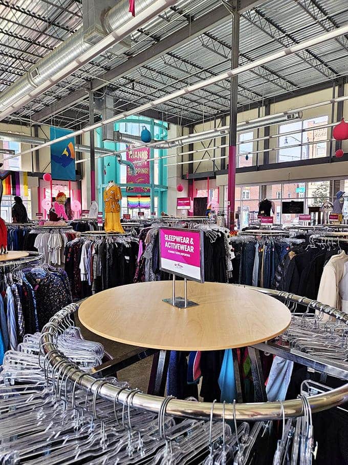 Racks upon colorful racks create a textile jungle where fashion treasures hide in plain sight.