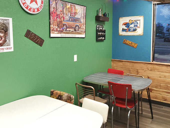 Vibrant green walls adorned with vintage automotive memorabilia create the perfect backdrop for sugar-fueled conversations and coffee-accompanied contemplations.