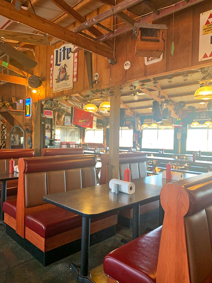 Step into a time capsule of Americana where wooden beams, vintage signs, and red vinyl booths create the perfect backdrop for fish fry magic.