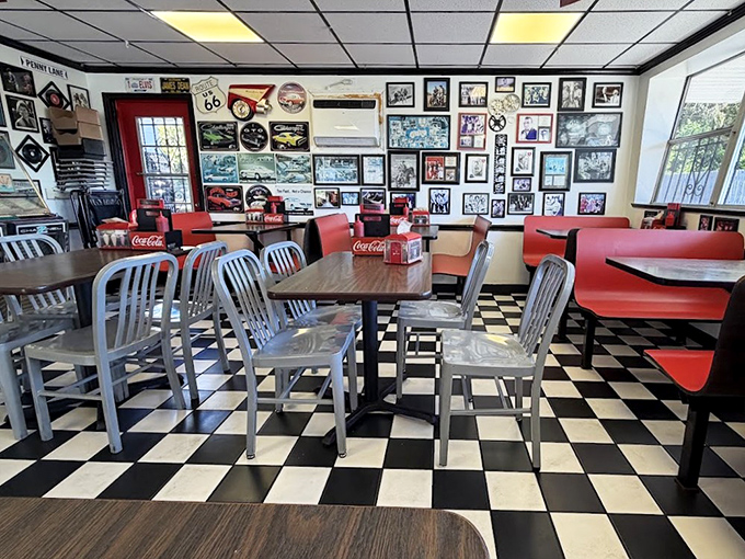 Step inside to a black-and-white checkered wonderland where every booth tells a story and memorabilia transforms meals into time travel.