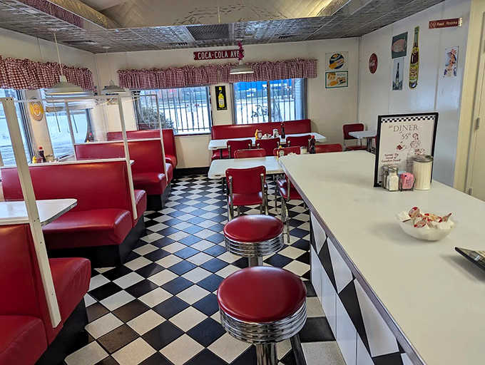 Red vinyl booths and checkerboard floors create the perfect backdrop for morning conversations and coffee refills that never seem to end.