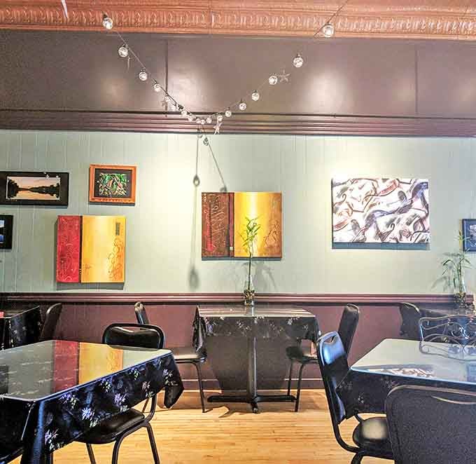 Inside Pasong's, string lights dance overhead while local artwork adds splashes of color to mint-green walls. The vibe? Part Michigan, part Bangkok, all charm.