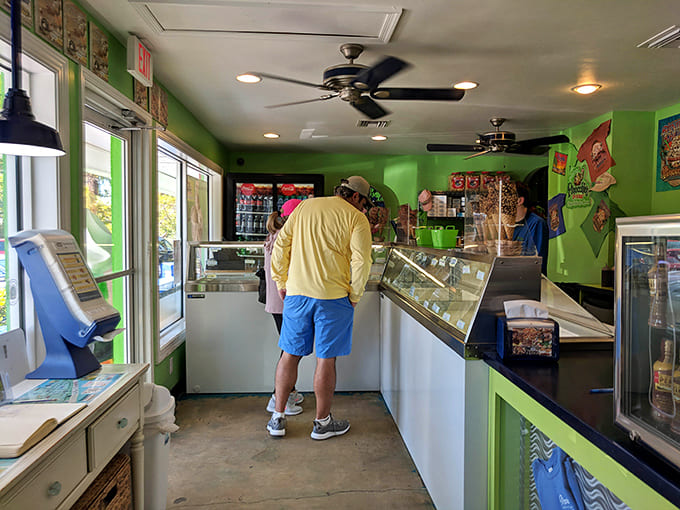 Inside the cozy shop, customers deliberate over colorful frozen treasures while friendly staff stand ready to scoop up happiness by the spoonful.