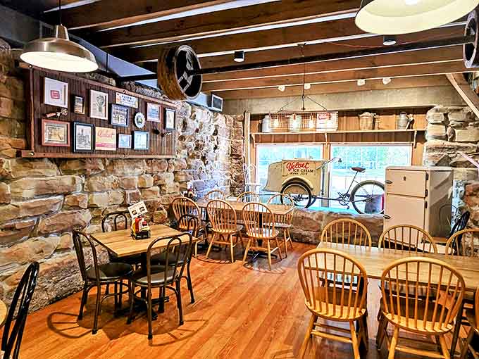 Stone walls and wooden beams create a rustic time capsule where ice cream lovers gather at tables that have witnessed decades of sweet moments.