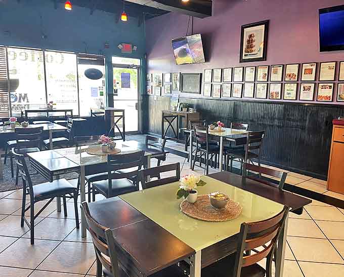 Teal walls and simple furnishings create the perfect backdrop for donut artistry, like a gallery where the masterpieces are edible.