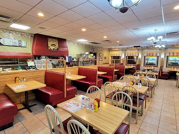 Classic diner charm awaits inside with cozy red booths and wooden tables – the stage for culinary magic.