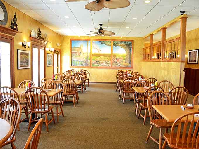 Interior: Golden walls and Windsor chairs create the perfect backdrop for lingering conversations and memorable meals in this warmly lit dining room.