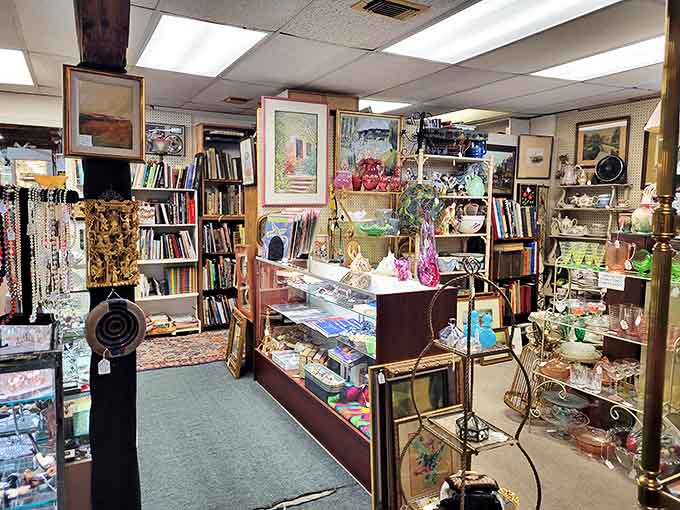 A wonderland of organized chaos where bookshelves meet display cases, creating narrow pathways through decades of American history and personal treasures.