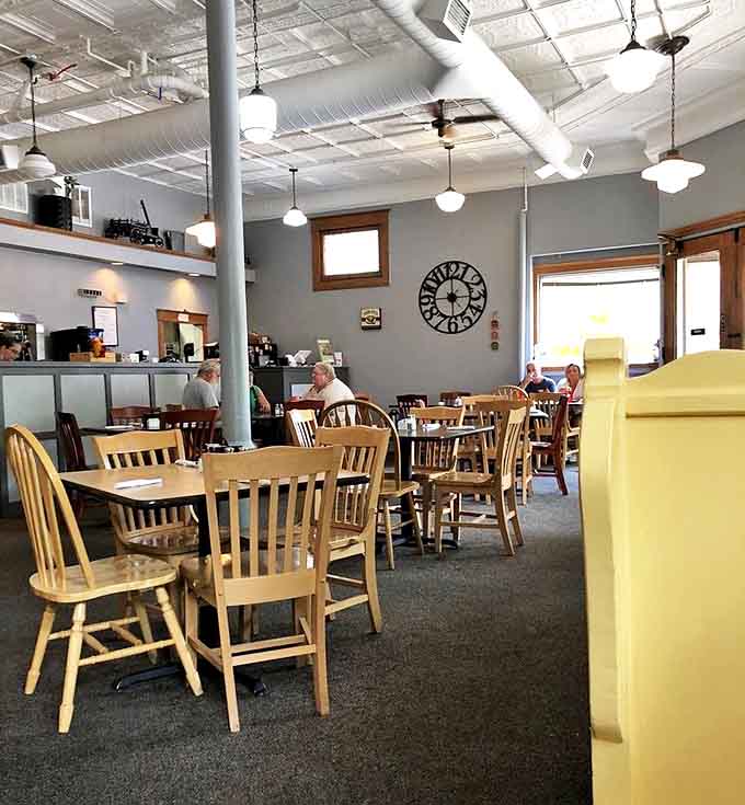 Pressed tin ceilings and soft gray walls create the perfect backdrop for lingering over comfort food and good conversation.