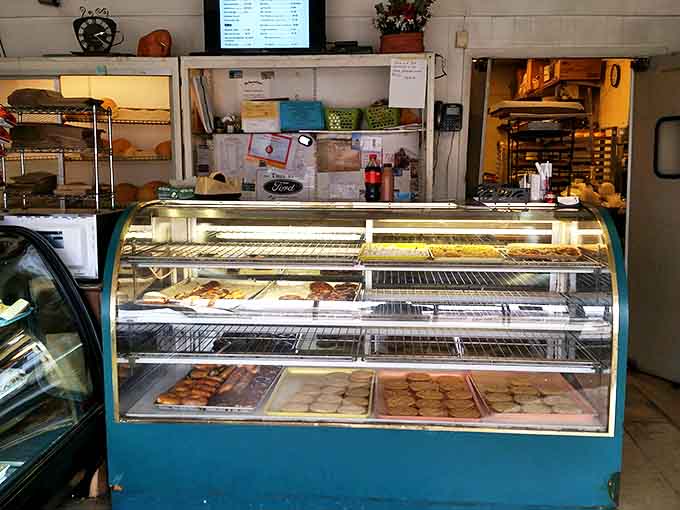 Behind the counter, where magic happens daily. The no-frills interior speaks volumes: here, it's the food that does all the talking.
