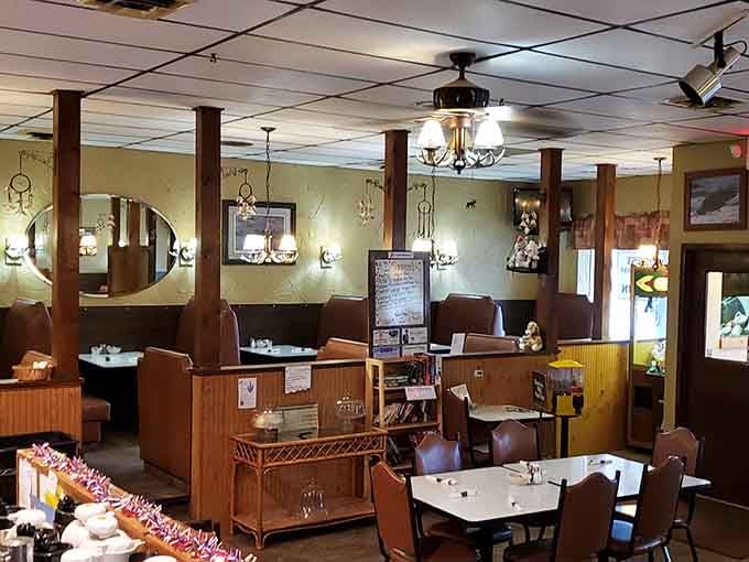 Step inside to discover warm wood tones and cozy booths where locals have been starting their mornings right for years, no reservations or pretension required.