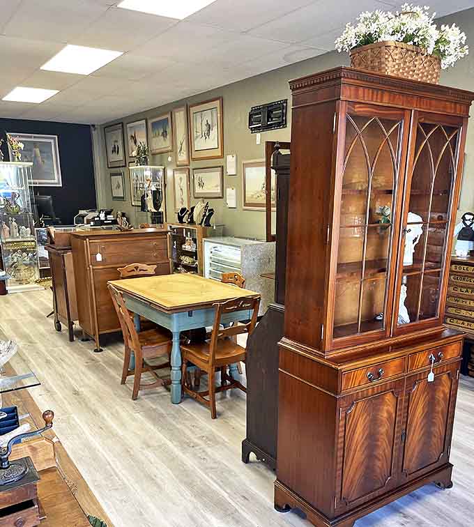 Elegant wooden furniture awaits new homes, each piece telling silent stories of dinner parties and family gatherings from decades past.