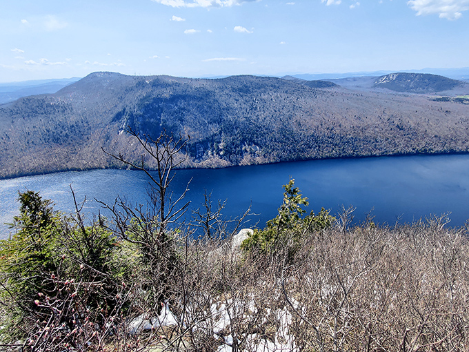 Nature's infinity pool: Lake Willoughby stretches between mountain walls like a sapphire nestled in Vermont's green velvet landscape.