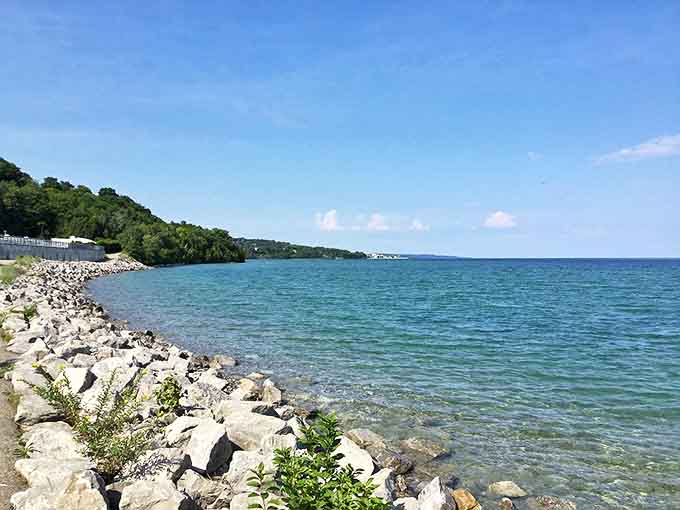 The Little Traverse Wheelway offers cyclists front-row seats to Lake Michigan's endless blue canvas against autumn's fiery backdrop.