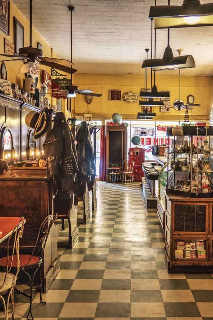 Checkerboard floors and vintage Coca-Cola signs create an atmosphere so authentically retro, you'll check your phone to confirm it's still 2024.