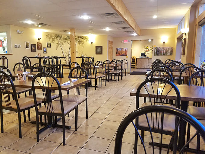 Warm light streams through both inside and out onto simple tables where strangers become friends over shared appreciation for perfectly executed breakfast classics.