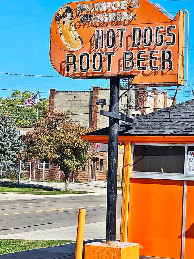 That faded orange sign isn't just advertising &ndash; it's a time portal to when "Hot Dogs" and "Root Beer" were all the invitation Americans needed for a perfect meal.