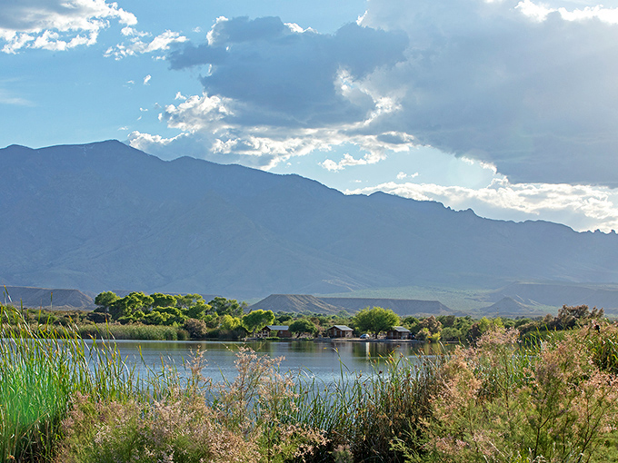 Morning light transforms the lake into nature's mirror, reflecting mountain silhouettes with such clarity you'll question which way is up.