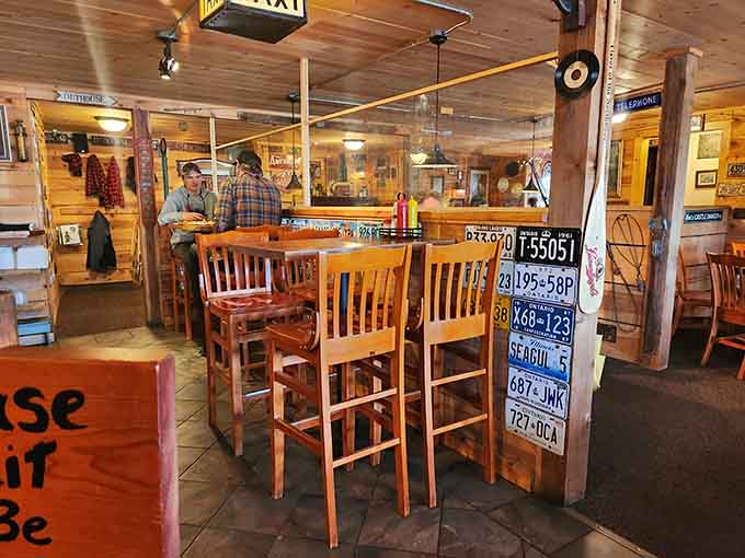 Vintage license plates and cozy wooden tables create an atmosphere that's pure North Woods charm with a side of nostalgia.