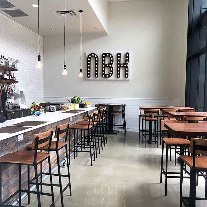 Inside Nolabelle, modern industrial chic meets warm hospitality, creating the perfect backdrop for your next memorable meal in downtown Mankato.