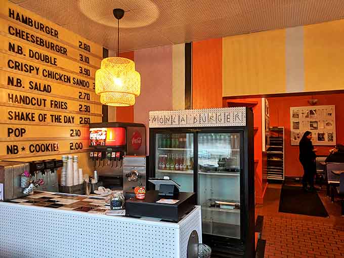 Interior: Retro vibes meet modern tastes in Nonla's colorful interior, where vintage-inspired design creates the perfect backdrop for serious burger business.