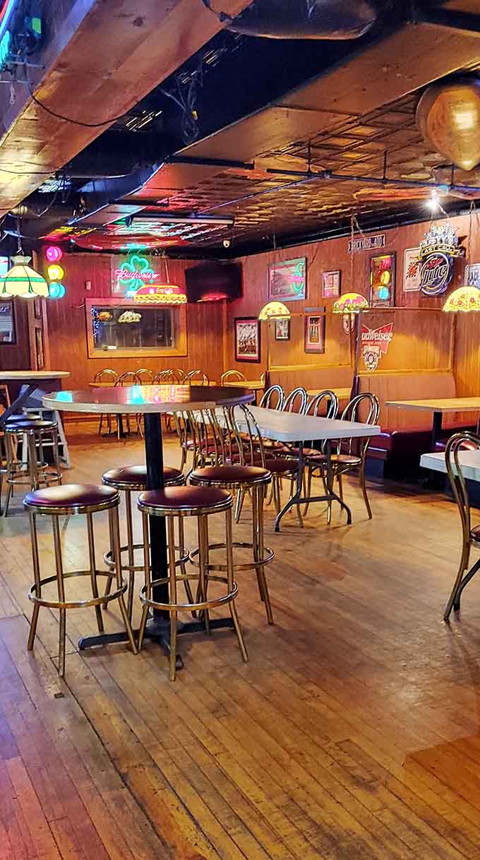 Step inside to discover warm wood tones, neon signs, and that perfect neighborhood tavern vibe.