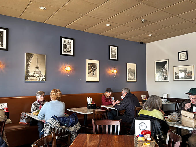 French photography adorns walls where locals gather, proving Minnesota does European charm better than you'd expect from the Midwest.
