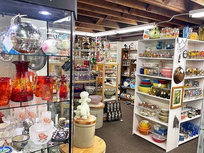 Colorful vintage glassware catches the light, each piece whispering stories of dinner parties and special occasions past.