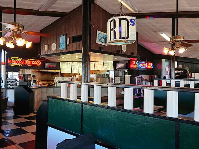 Step inside to find checkered floors and green vinyl booths that transport you straight back to drive-in dining's golden era.
